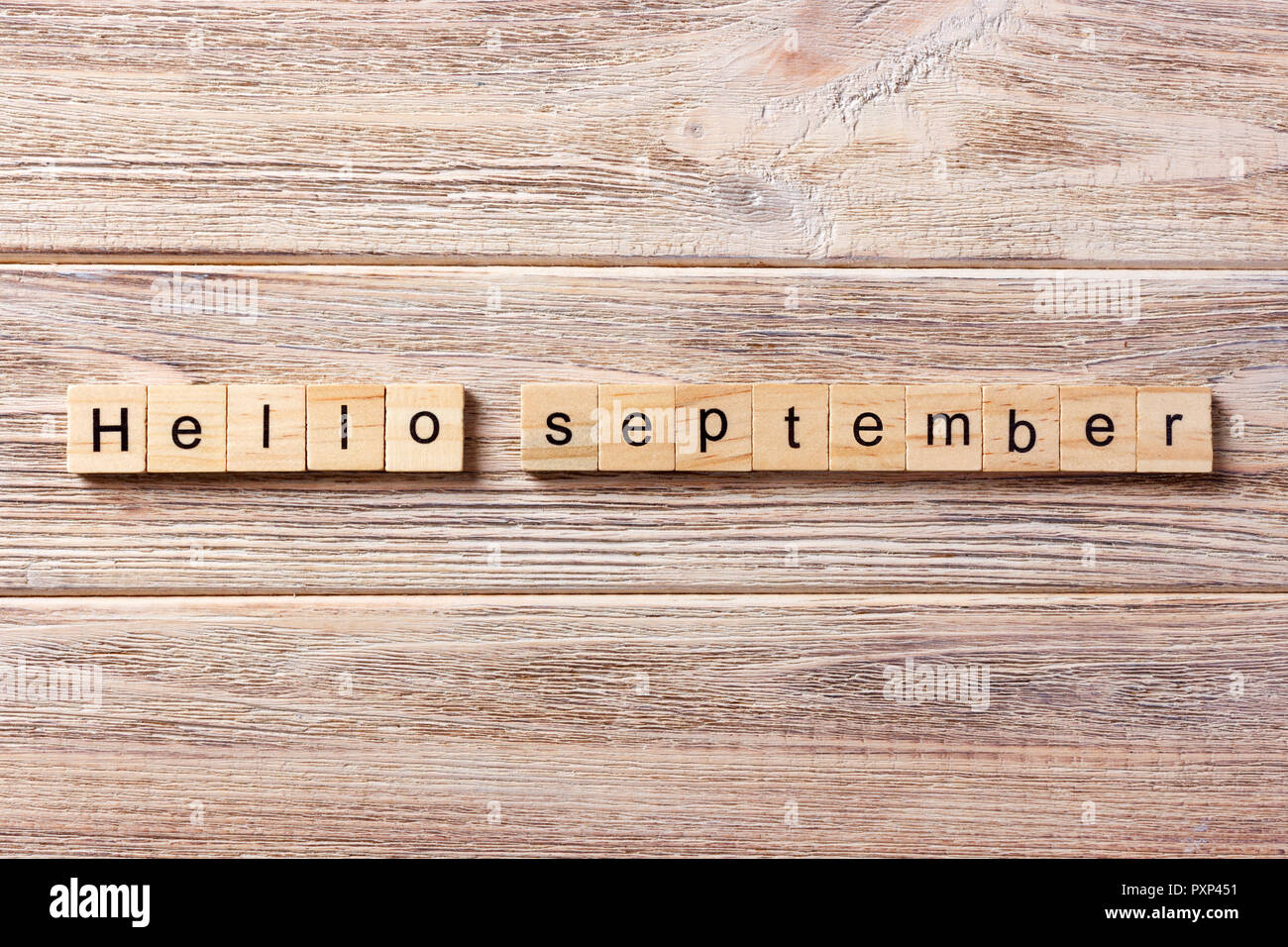 hello September word written on wood block. hello September text on ...