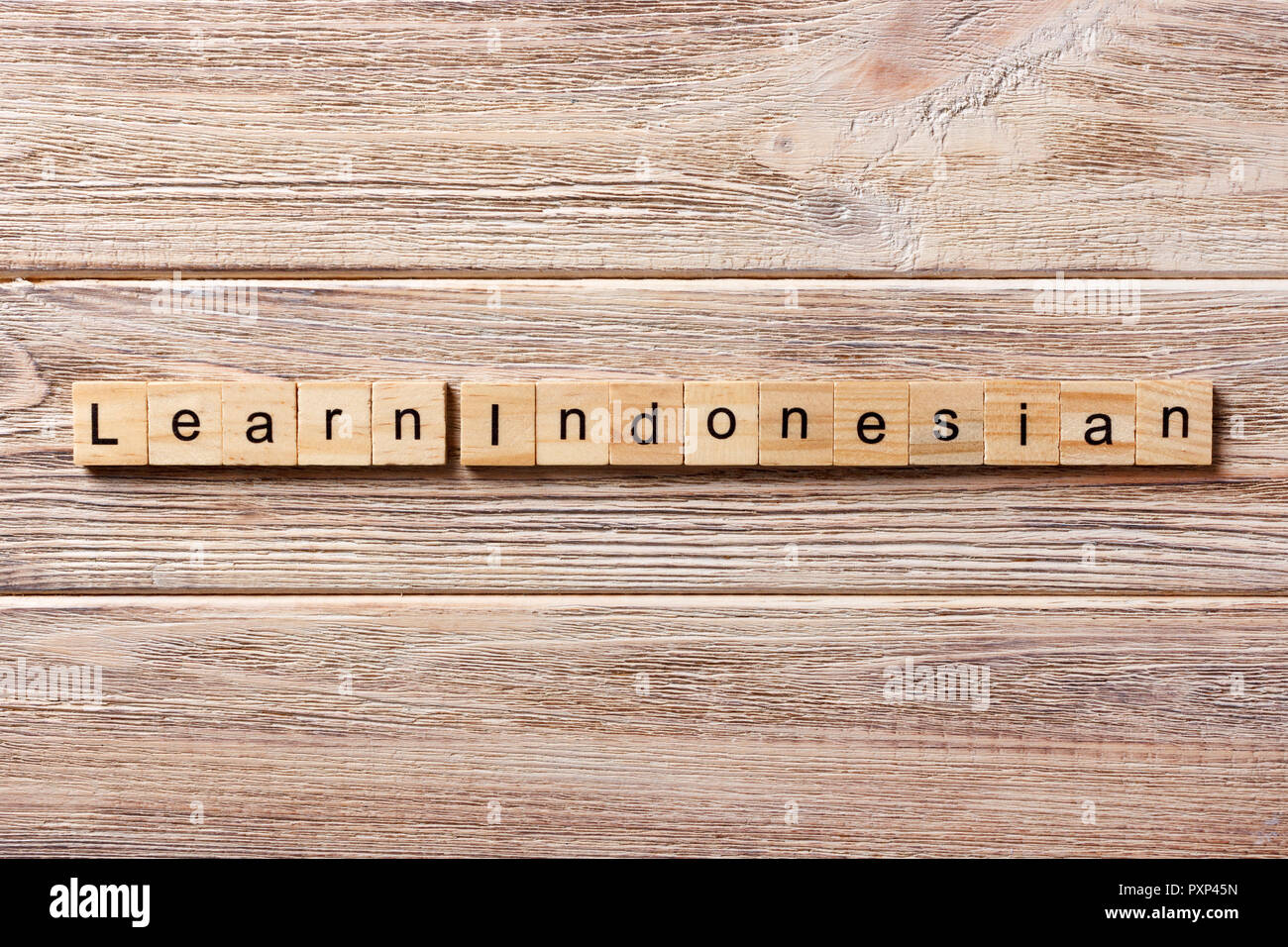 learn indonesian word written on wood block. learn indonesian text on ...