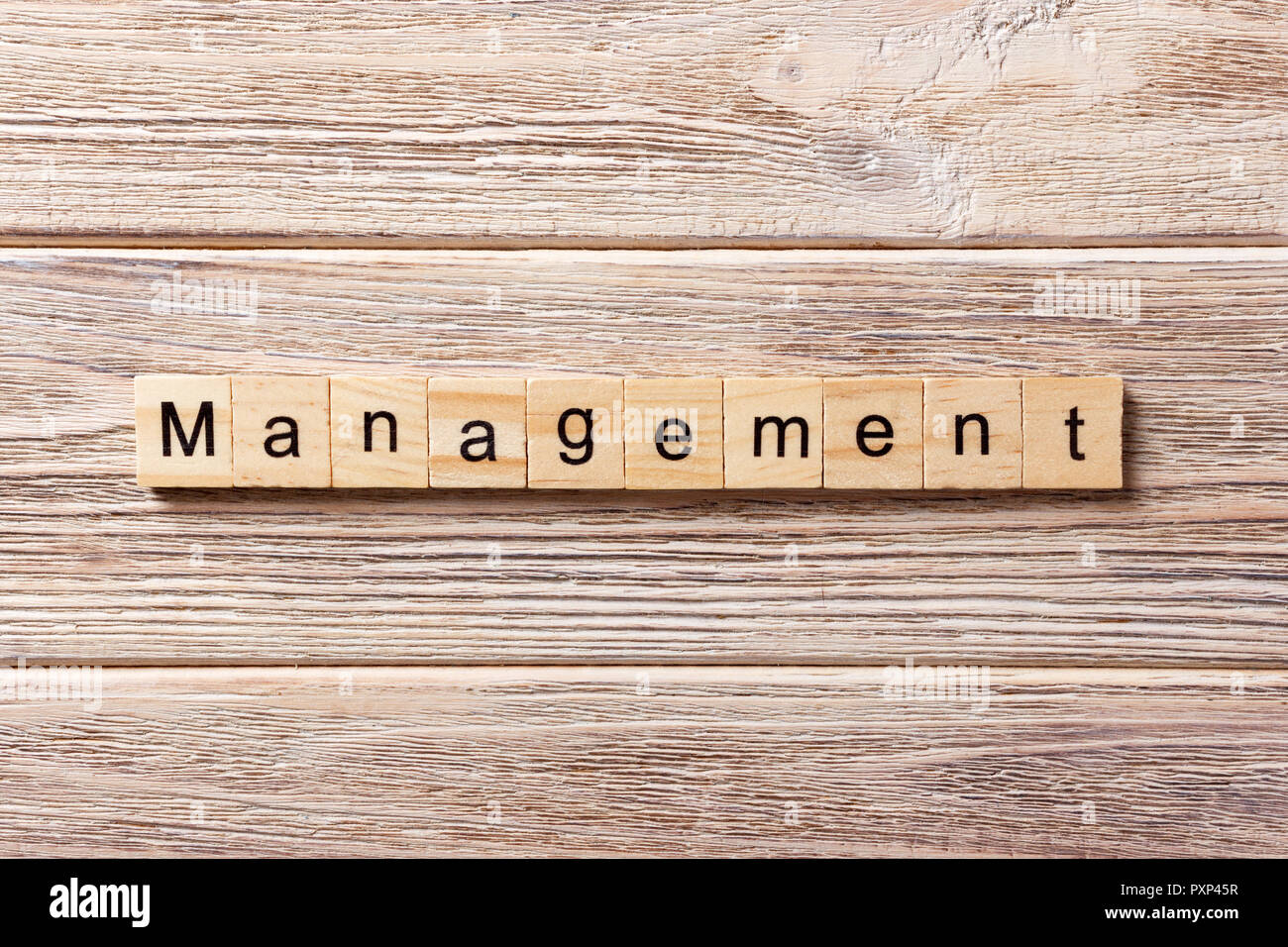 management word written on wood block. management text on table ...