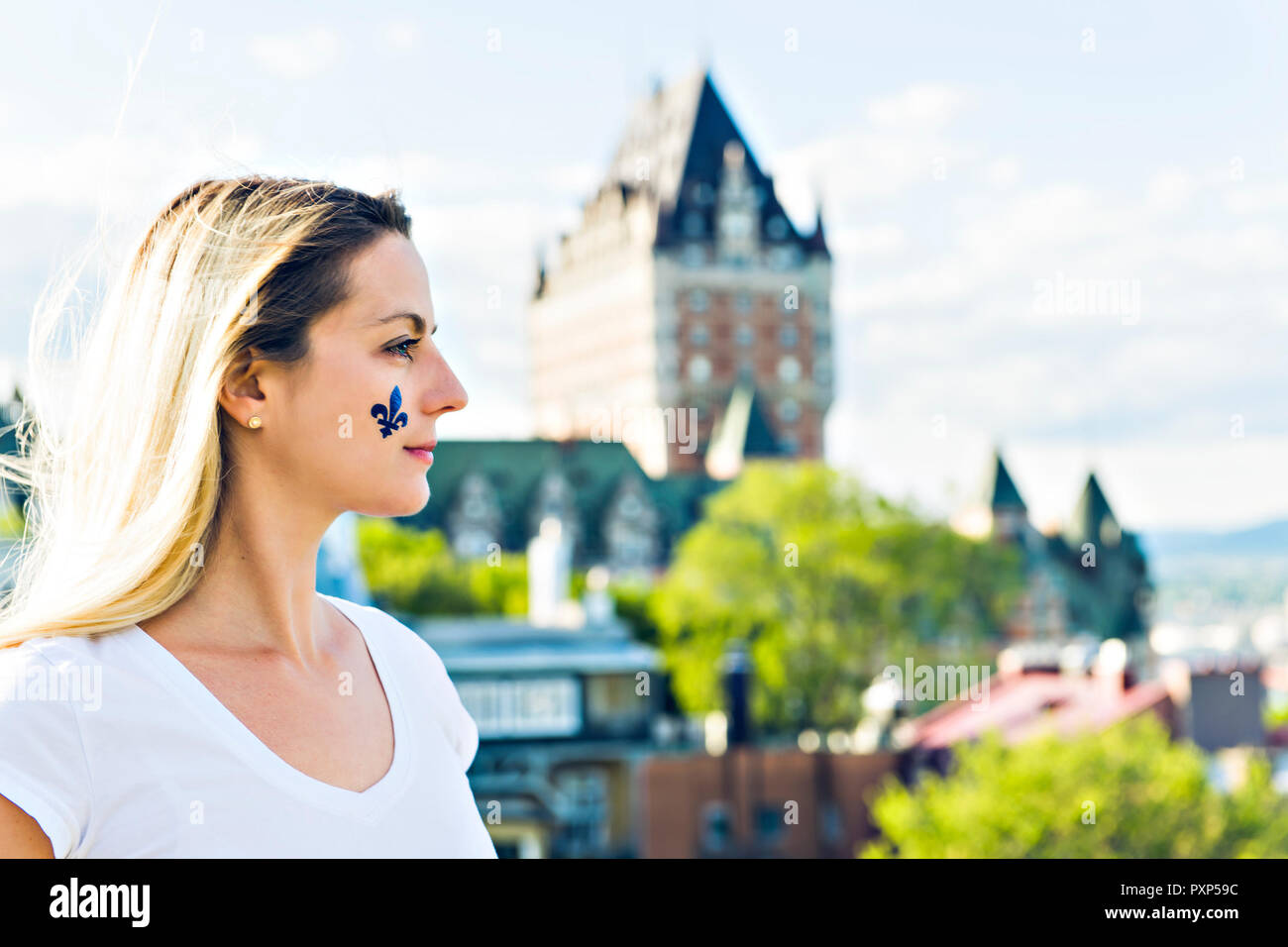 Woman celebrates the national holiday in front of Chateau Frontenac in ...