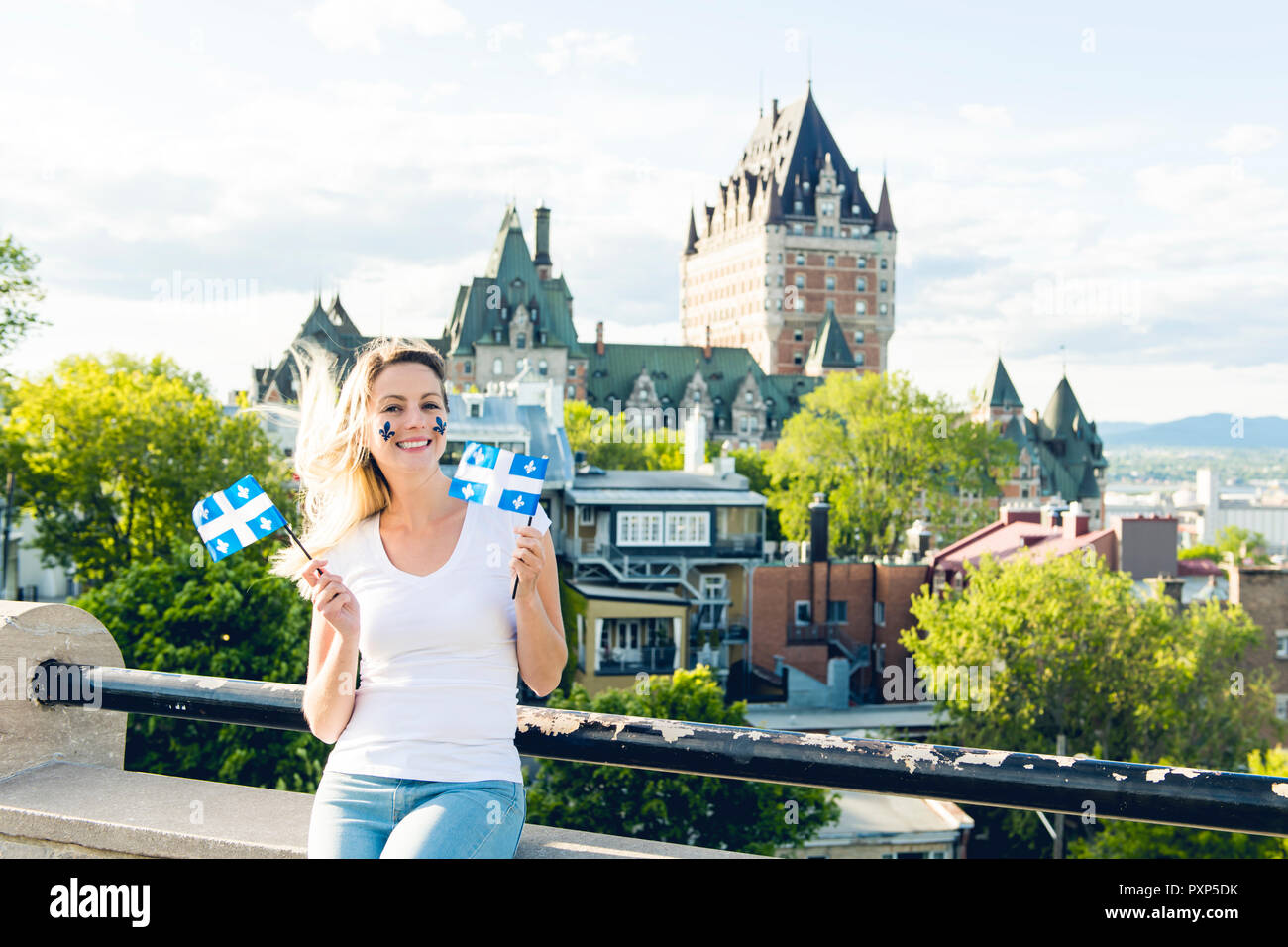 Woman celebrates the national holiday in front of Chateau Frontenac in ...