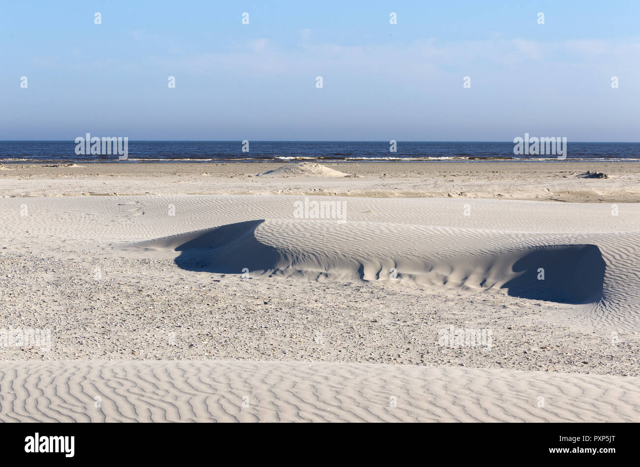 Beach in the middle of the day, shadows forming Stock Photo - Alamy