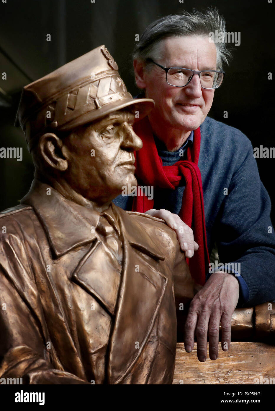 Artist and sculptor Bronislaw Krzysztof stands alongside the memorial ...