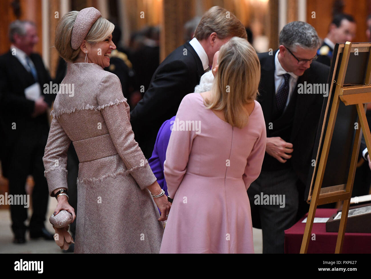 Queen Maxima of the Netherlands laughs during a viewing of Dutch items ...