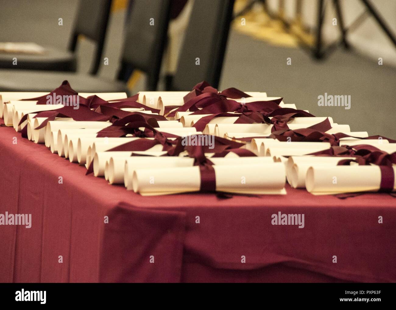 Diplomas for Graduate Medical Education graduates are lined up during ...