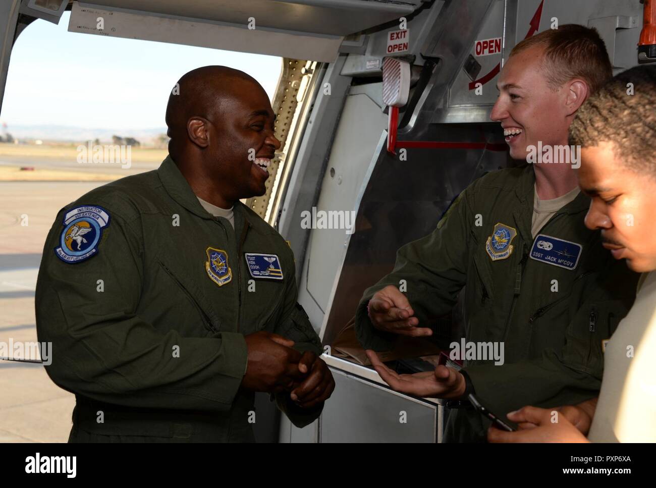 Tech. Sgt. Kenneth Cook (Left), 6th Air Refueling Squadron, shares a ...