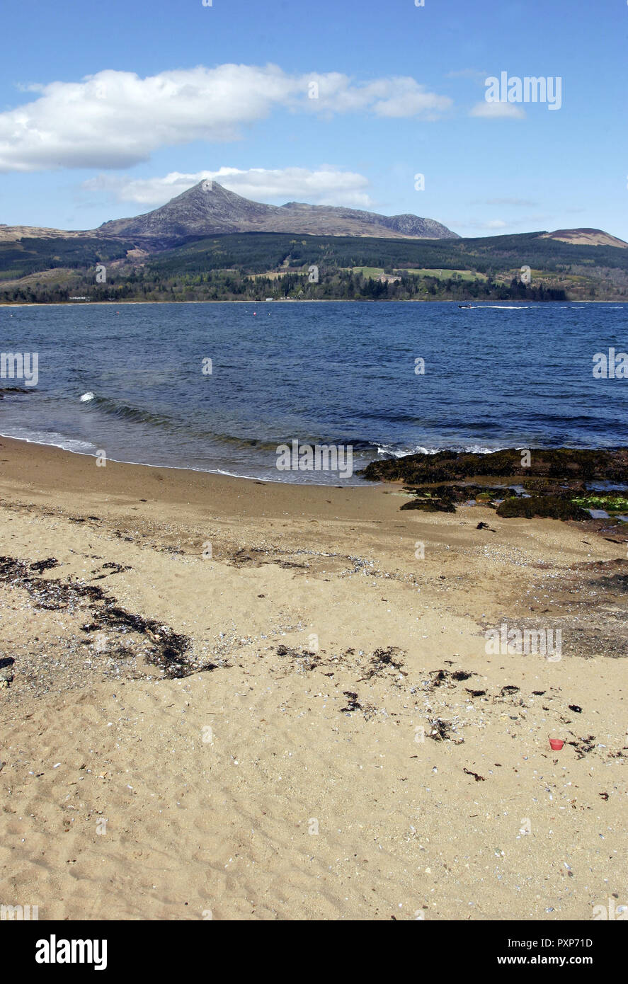 A lovely stretch of white sand with a backdrop of mountains, hills ...
