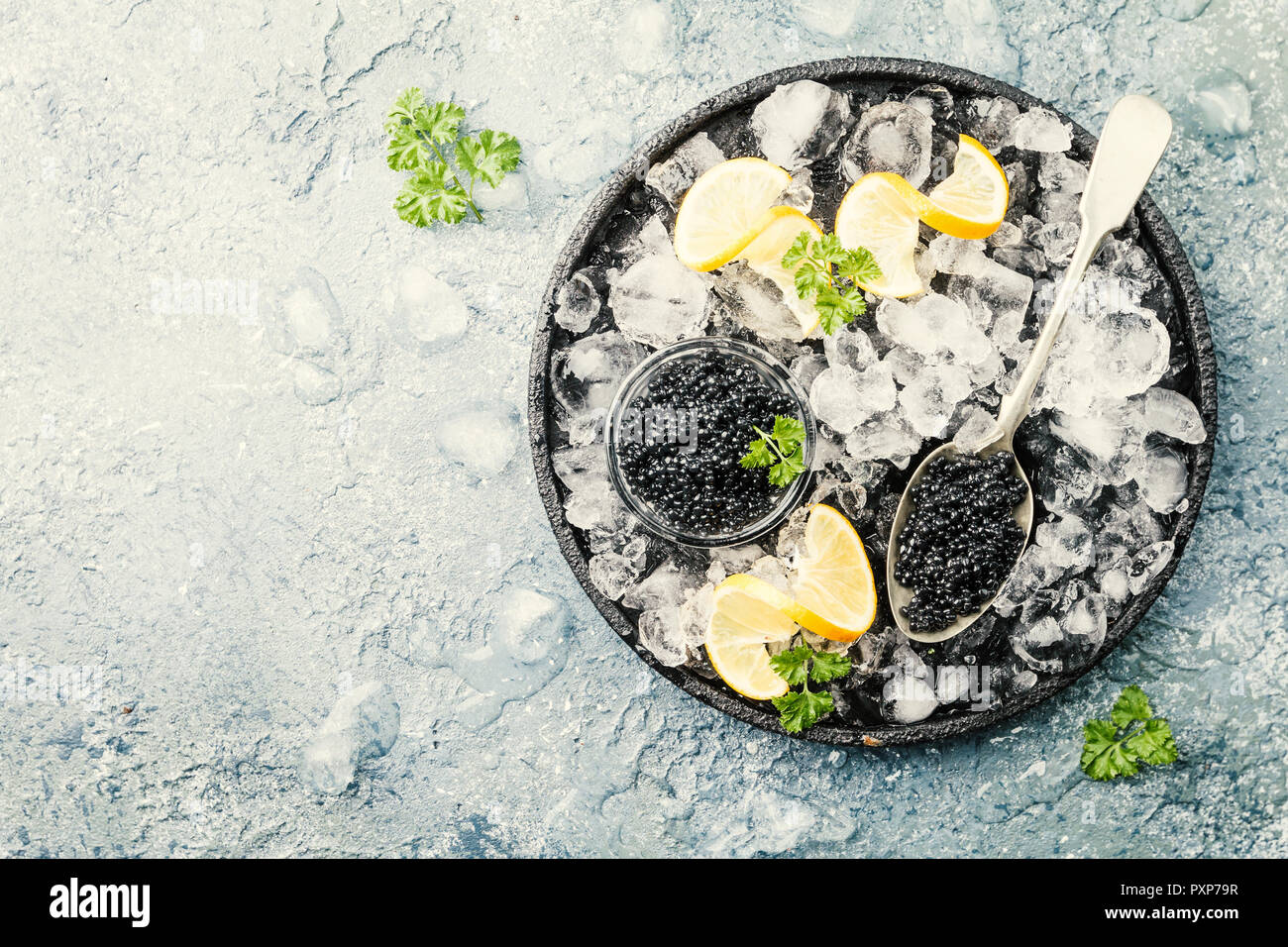 Black caviar on ice Stock Photo - Alamy