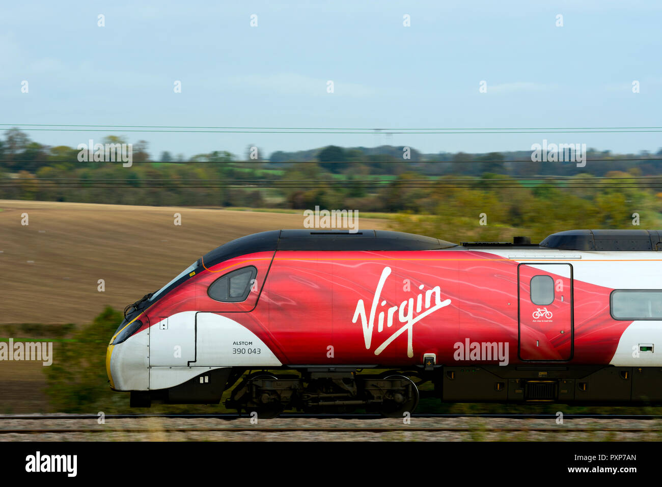 Virgin Trains Pendolino electric train, side view at speed ...