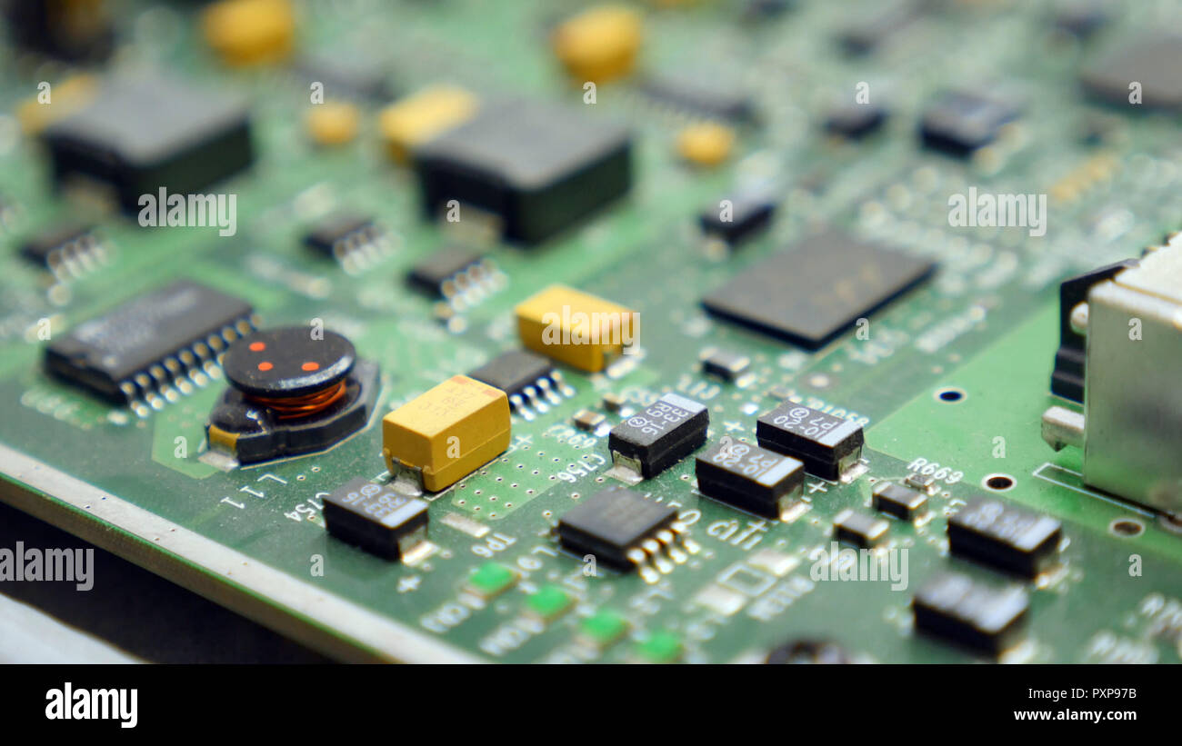 Electronic printed circuit board with many electrical components Stock ...