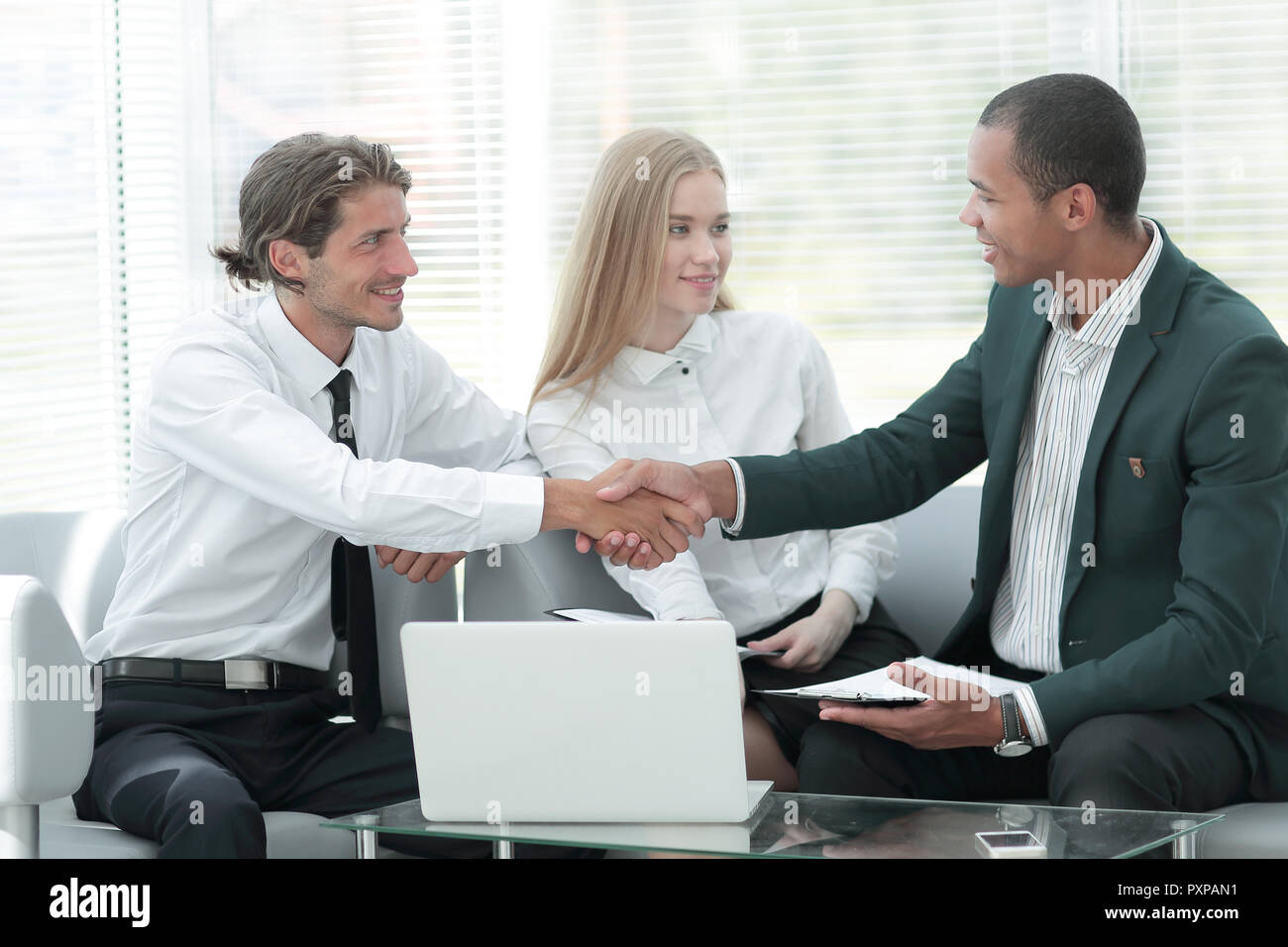 business partners greeting each other with a handshake Stock Photo - Alamy