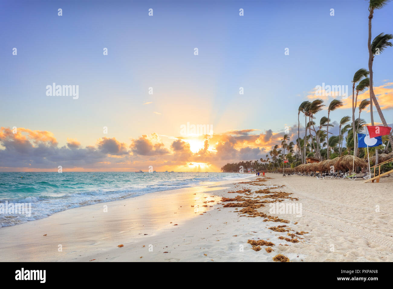 Vacation in Dominican Republic. Sunset sandy beach Stock Photo - Alamy