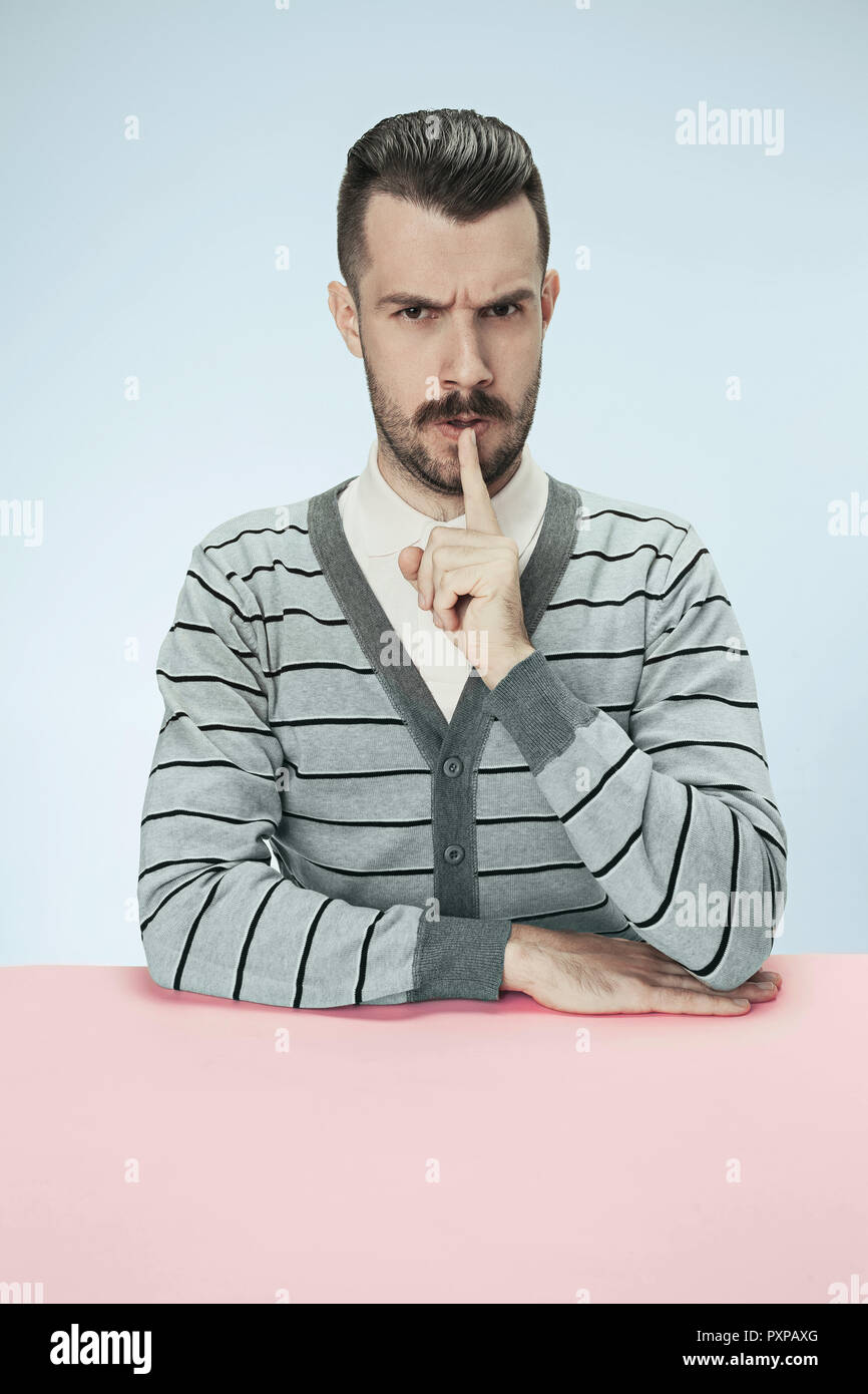 Shhhhh . Man calling to silence or telling a secret. Funny model ...