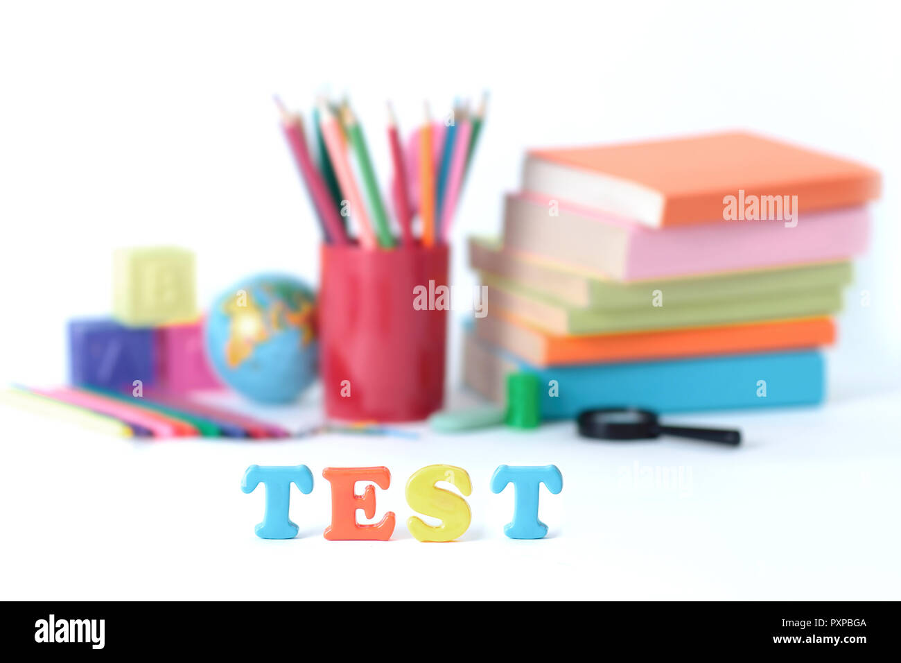 word test on the background of school supplies .photo with copy Stock ...