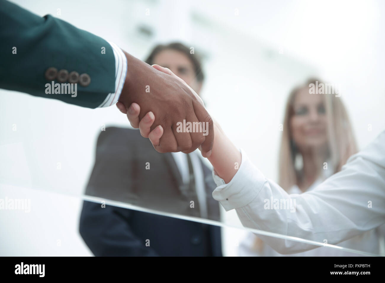 bottom view .handshake business women with a business partner Stock ...