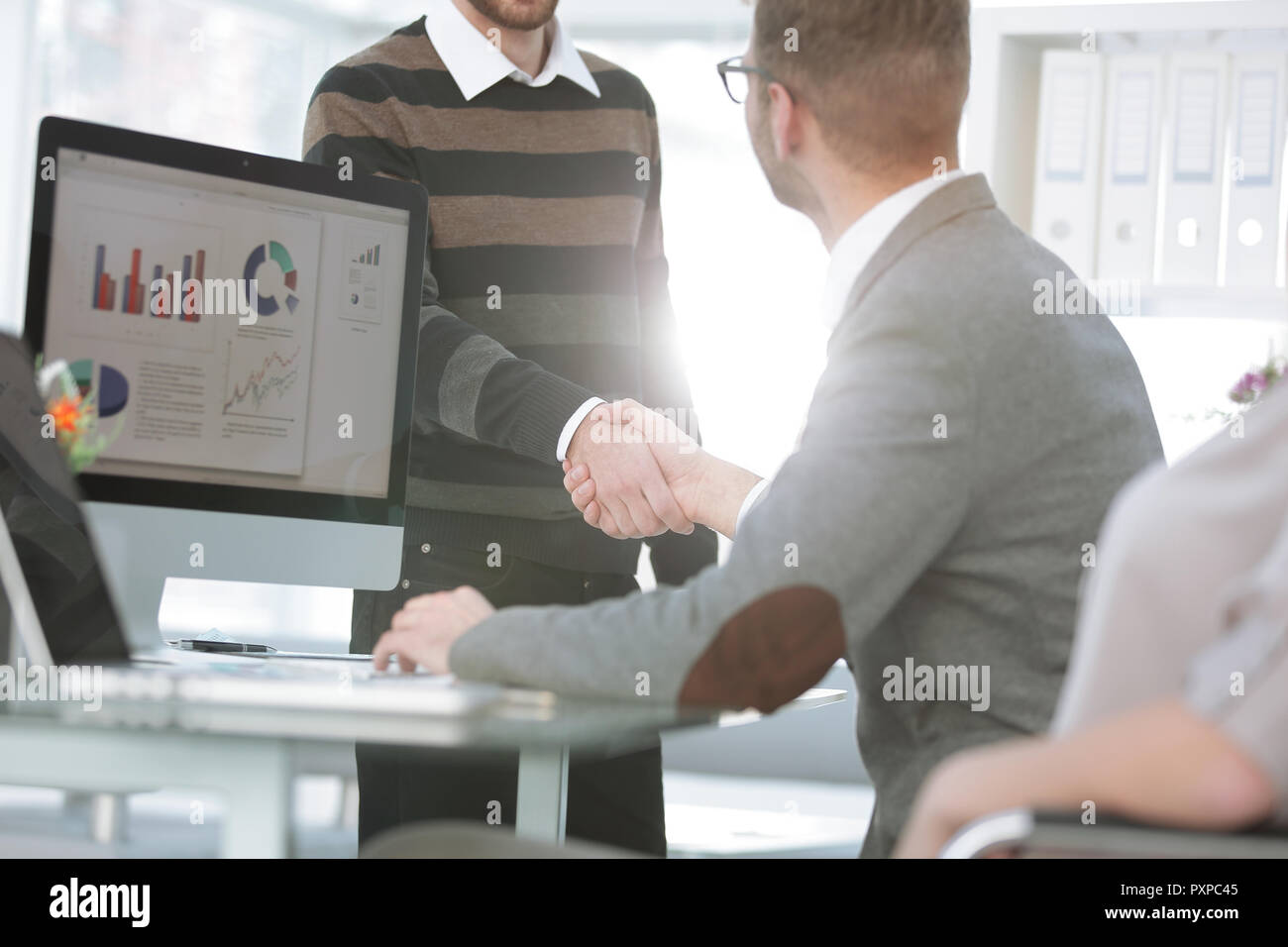 handshake colleagues in the workplace in the office Stock Photo - Alamy