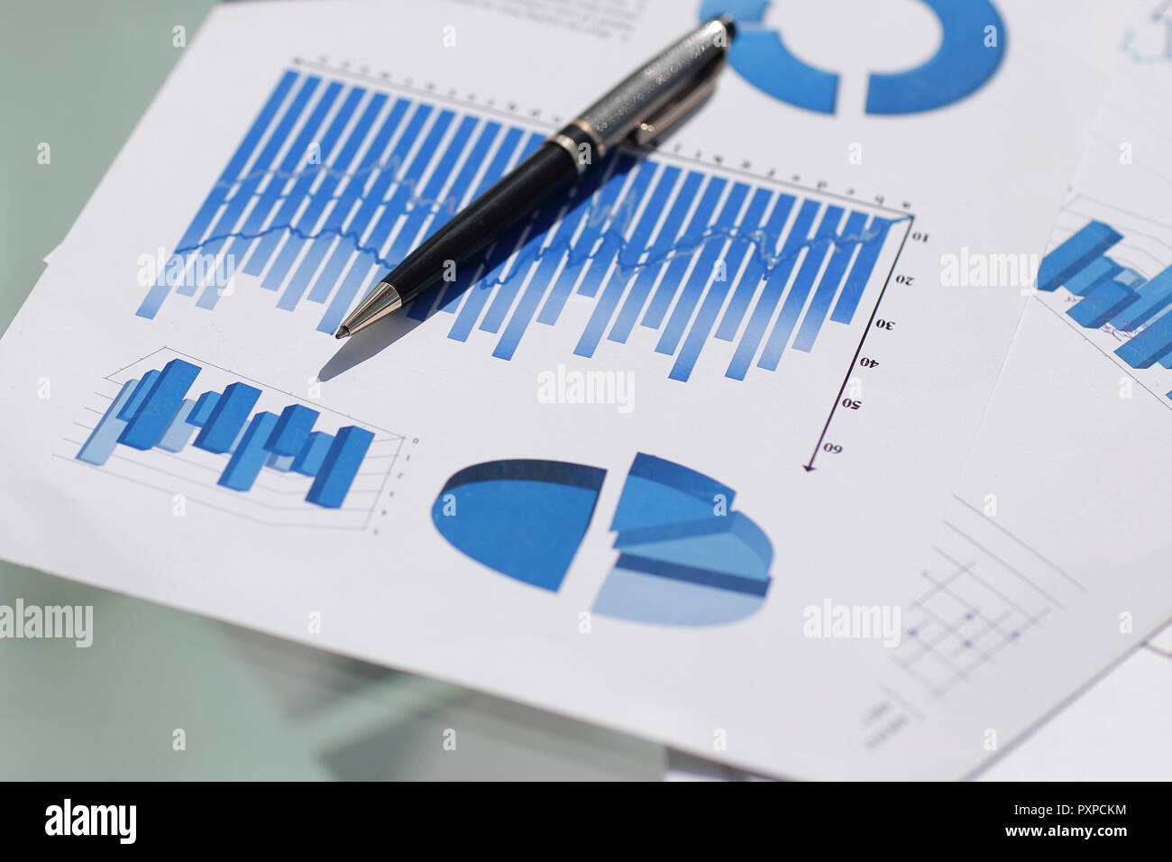 financial charts and graphs on the table Stock Photo - Alamy