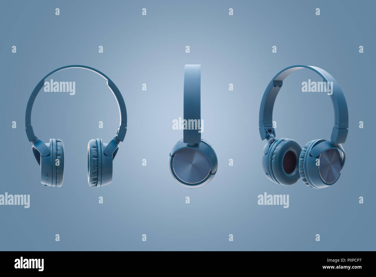 bluetooth blue headphone on blue background studio pack shot equipment ...