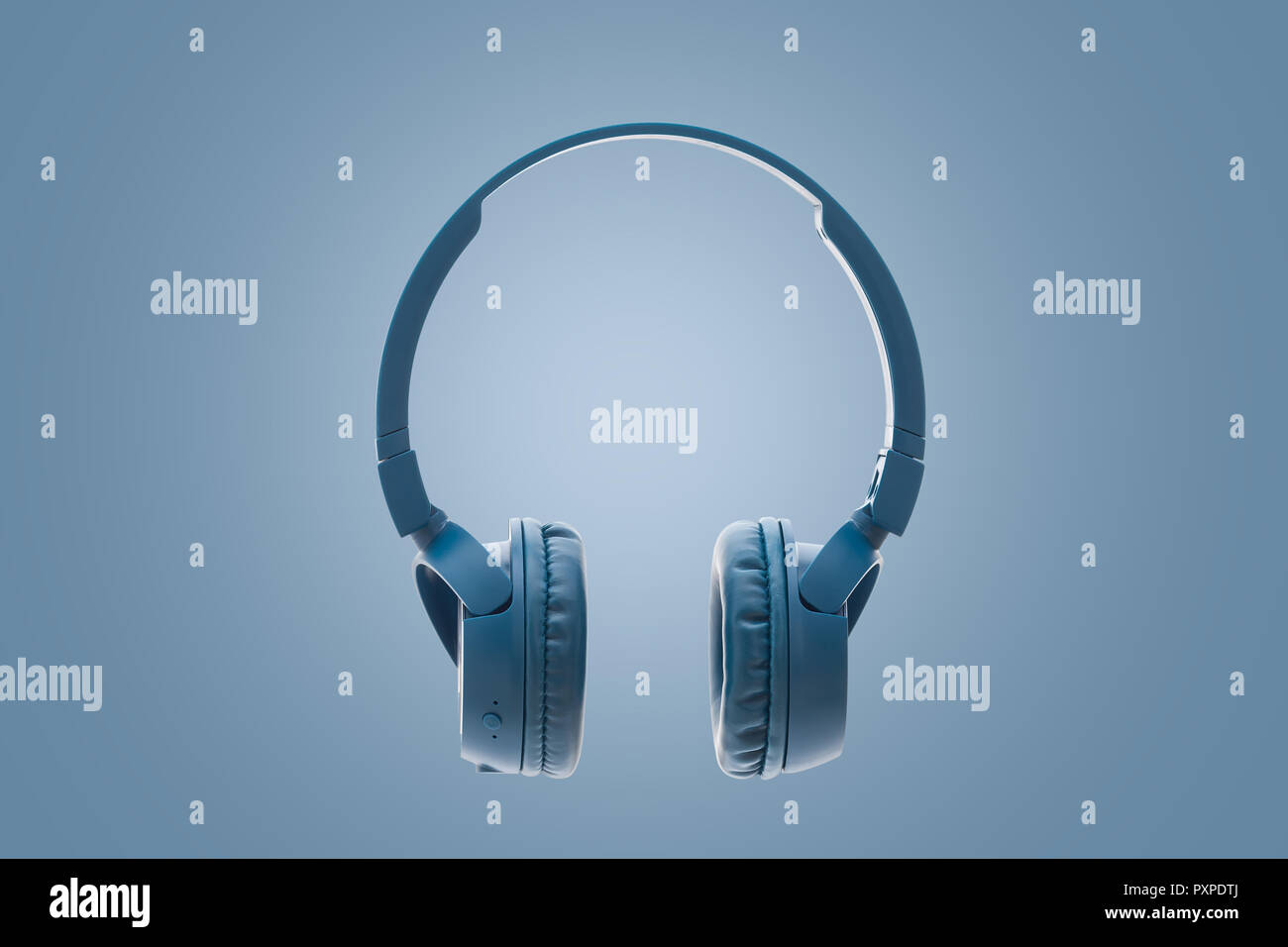 bluetooth blue headphone on blue background studio pack shot equipment ...