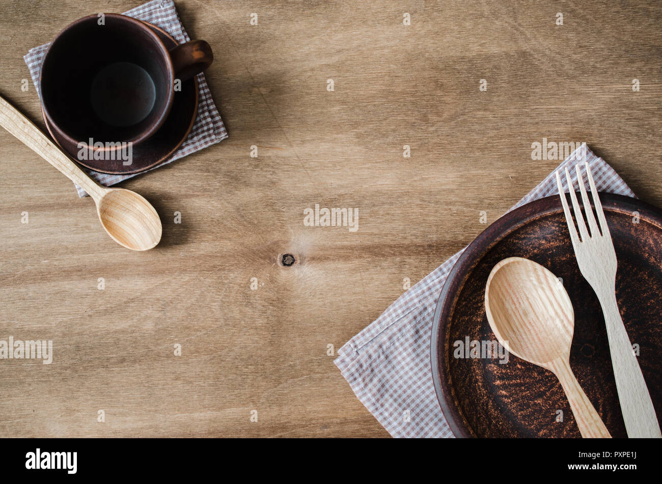 Rustic Kitchen Utensils: the Ceramic Plates and Wooden Cutlery on ...