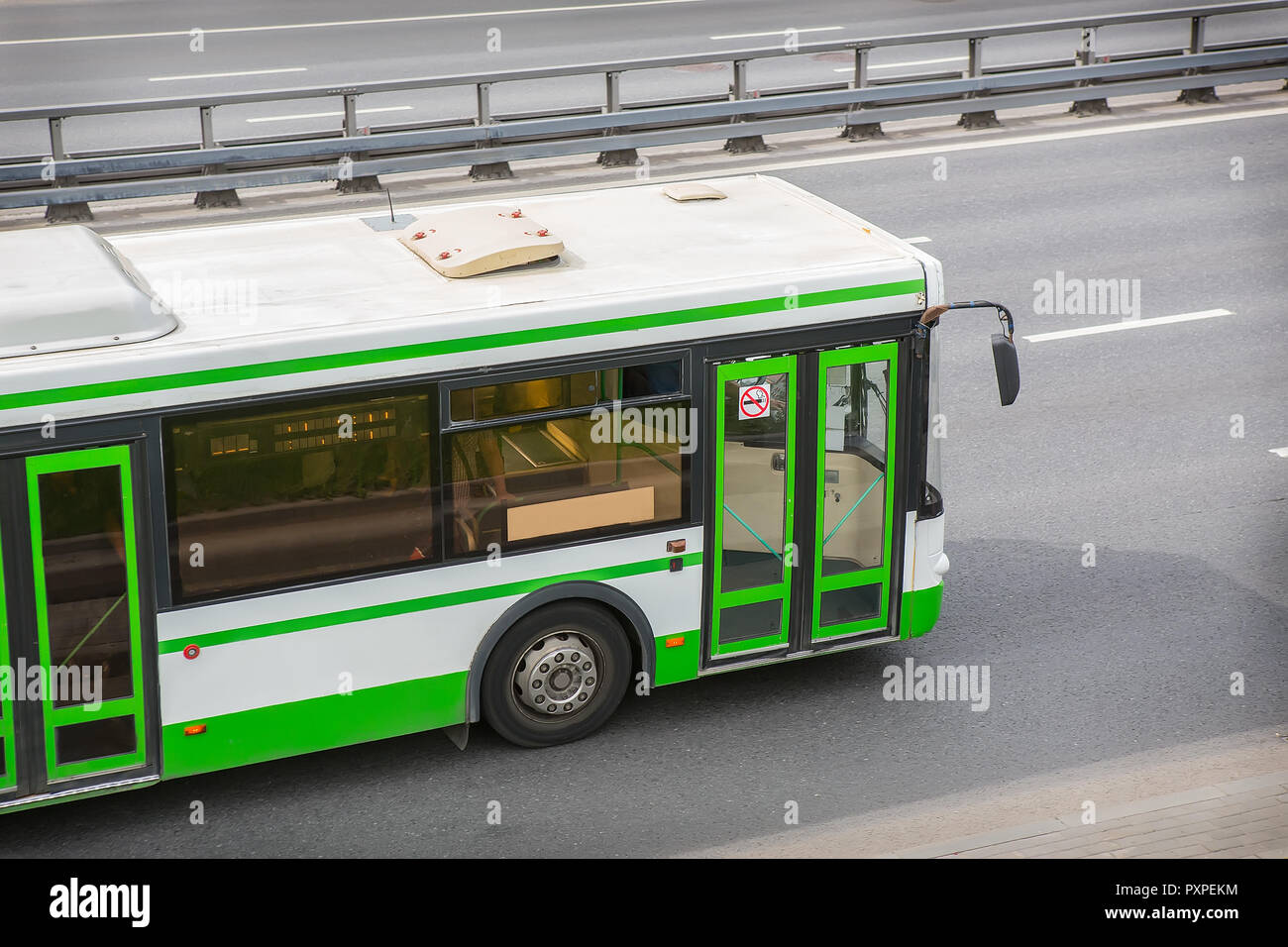 city bus goes along street Stock Photo - Alamy