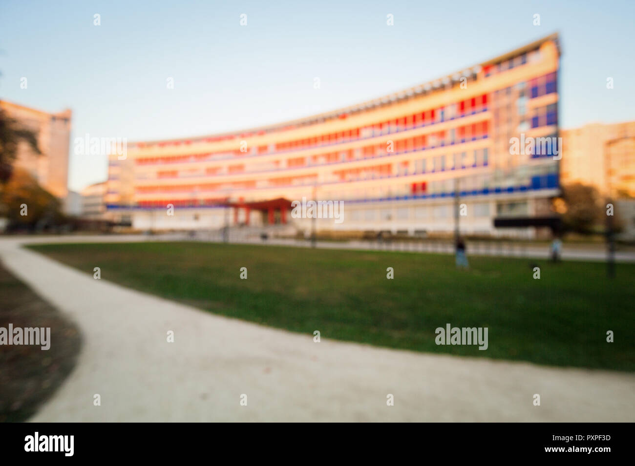 Outdoors blurred background of university campus with the building ...