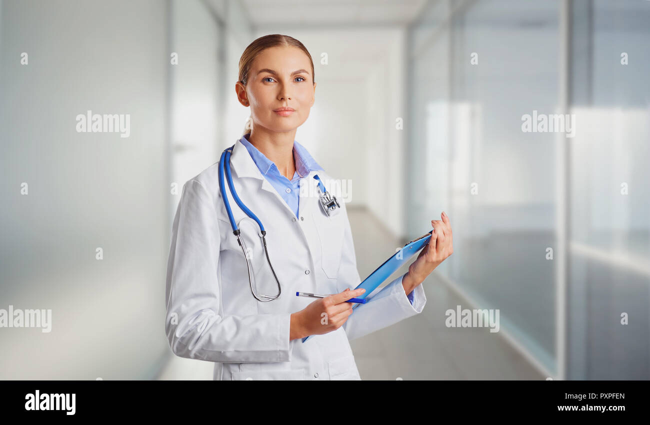 Doctor blonde in lab coat in the clinic Stock Photo - Alamy