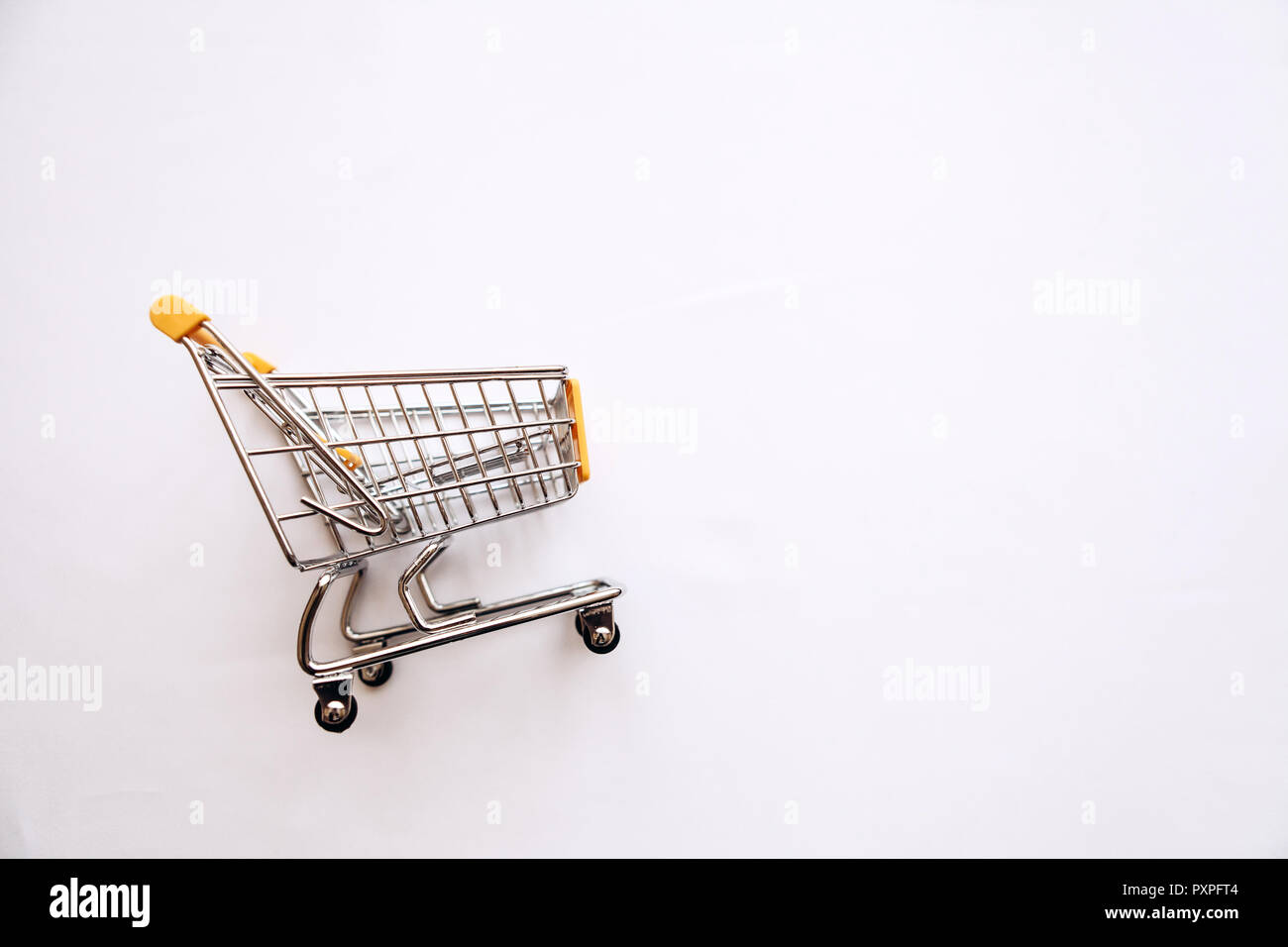 Empty cart for products and goods on a white background Stock Photo - Alamy