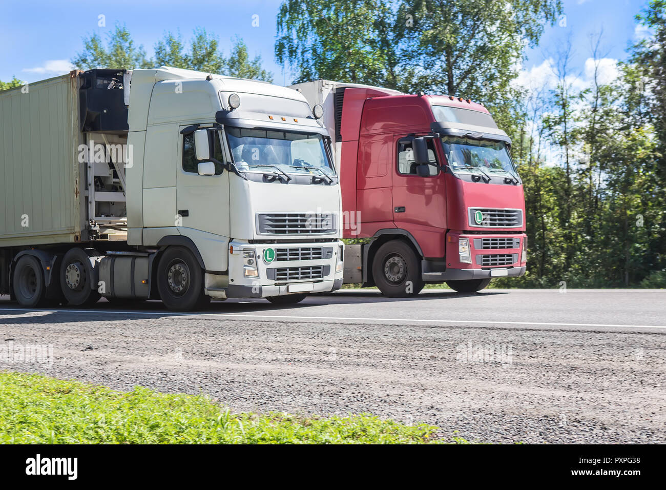 trucks transporting freight on the country highway Stock Photo - Alamy