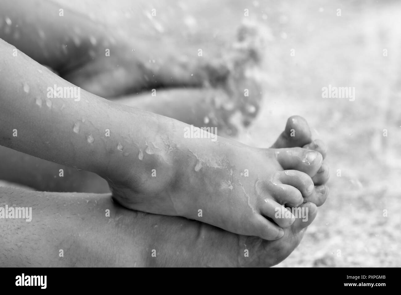 Hand and foot massage Black and White Stock Photos & Images - Alamy