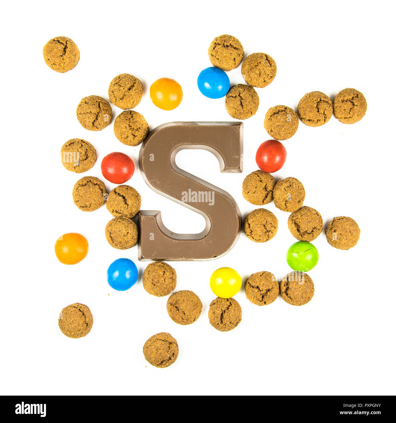 Chocolate letter S with bunch of scattered pepernoten cookies from ...