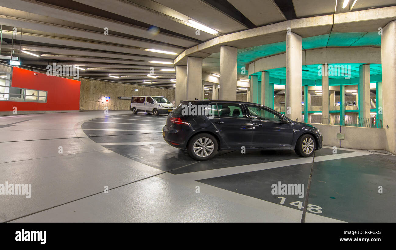 parked cars in Modern Underground circular parking garage Stock Photo ...