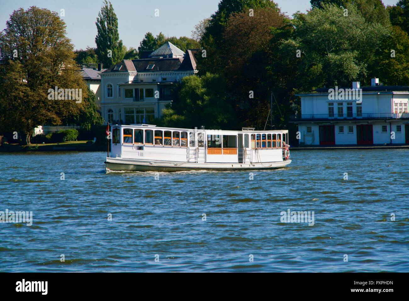 historical passenger ferry on a blue Alster lake in Hamburg Stock Photo ...