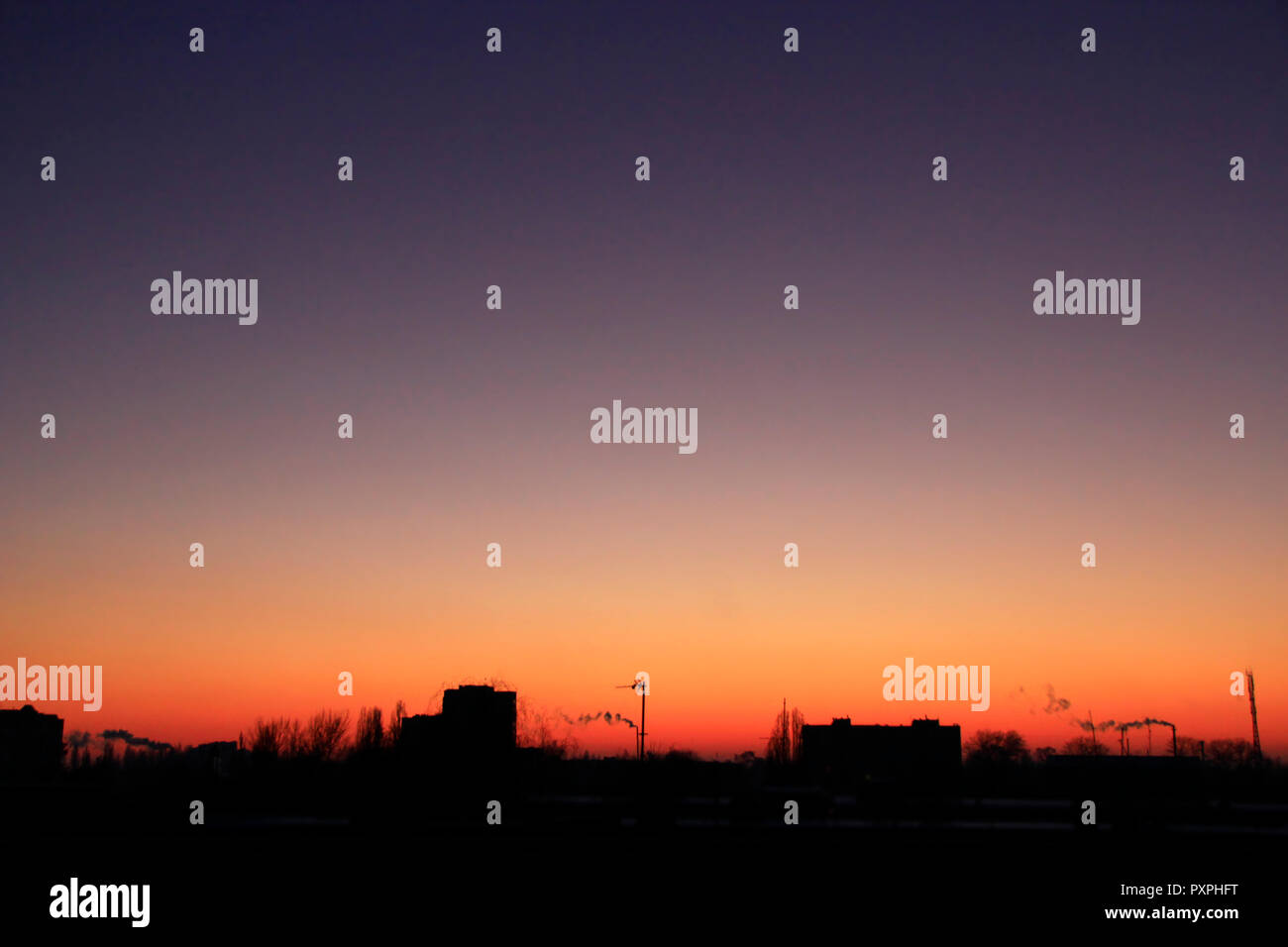 Dark sunset above multistory house. Evening cityscape. City landscape ...