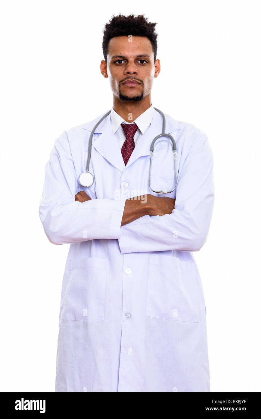 Studio shot of young African man doctor standing with arms cross Stock ...
