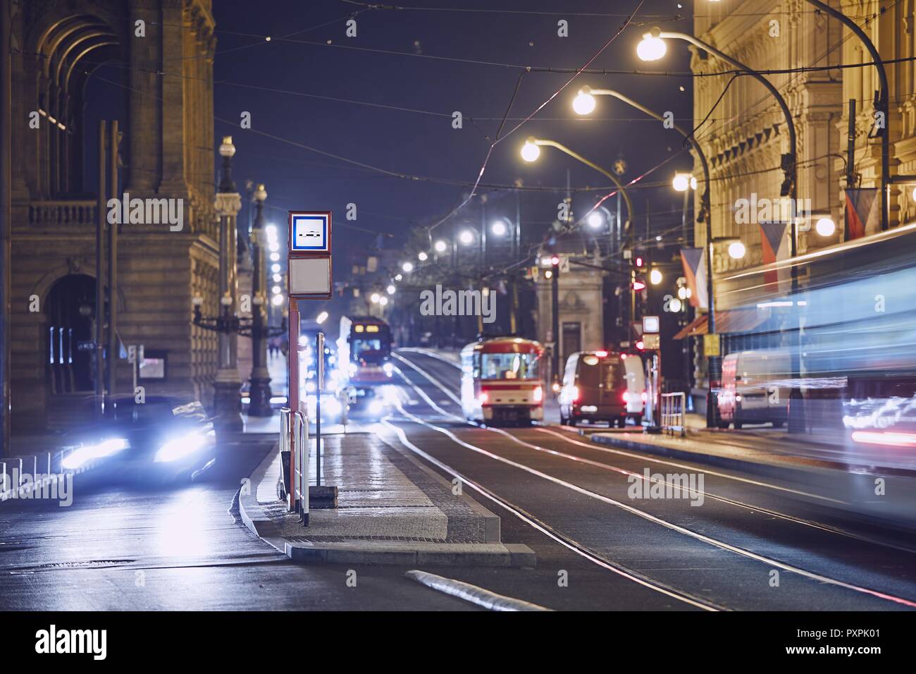 Traffic of trams and cars on the city street at night. Prague, Czech ...