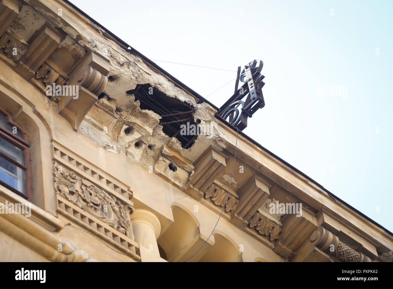 Broken facade of an old (interbelic period) building, left to rot ...