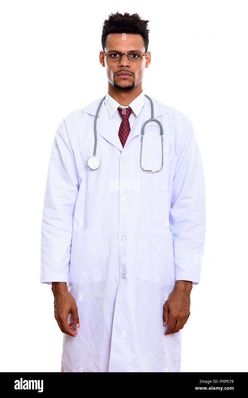 Studio shot of young African man doctor standing while wearing e Stock ...