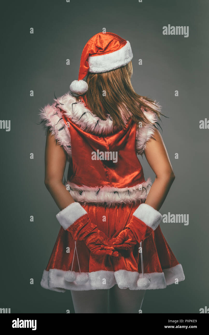 Woman santa hat rear view hi-res stock photography and images - Alamy
