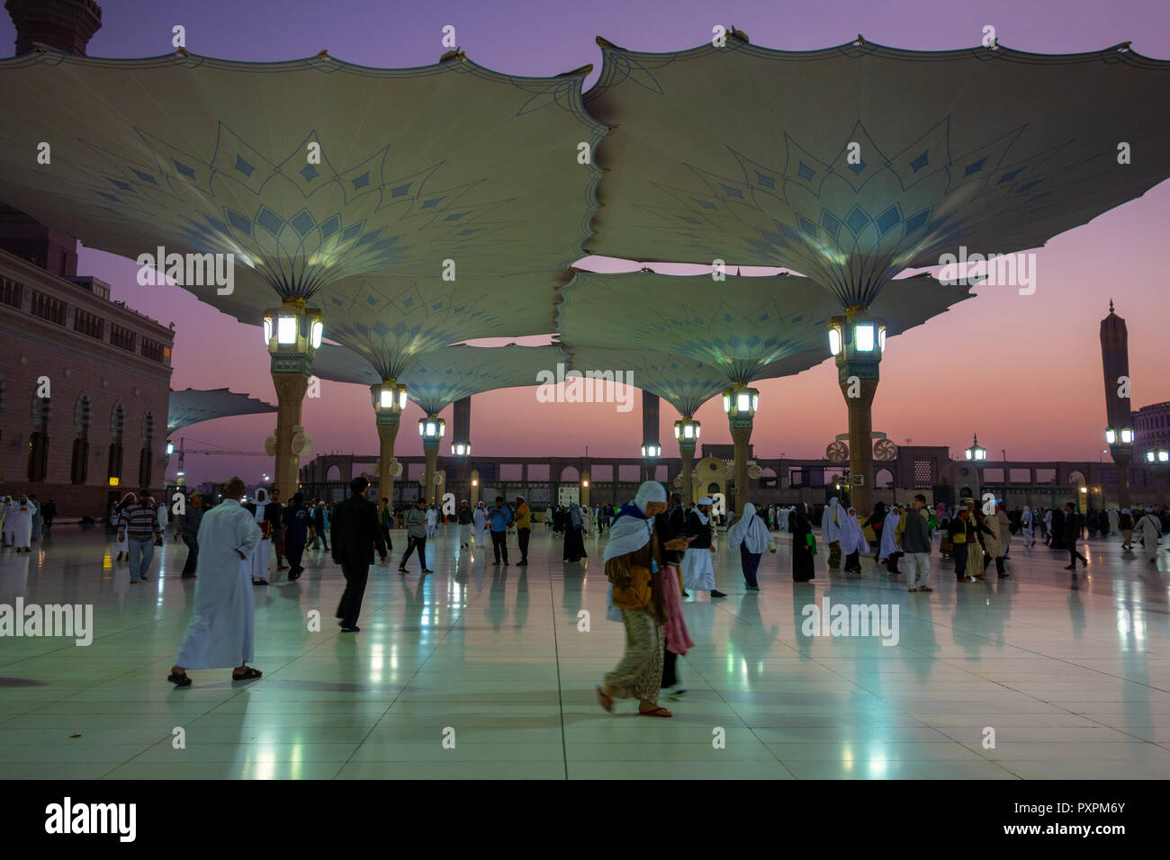 Giant canopies at Nabawi mosque in Medina, Saudi Arabia.during sunrise ...