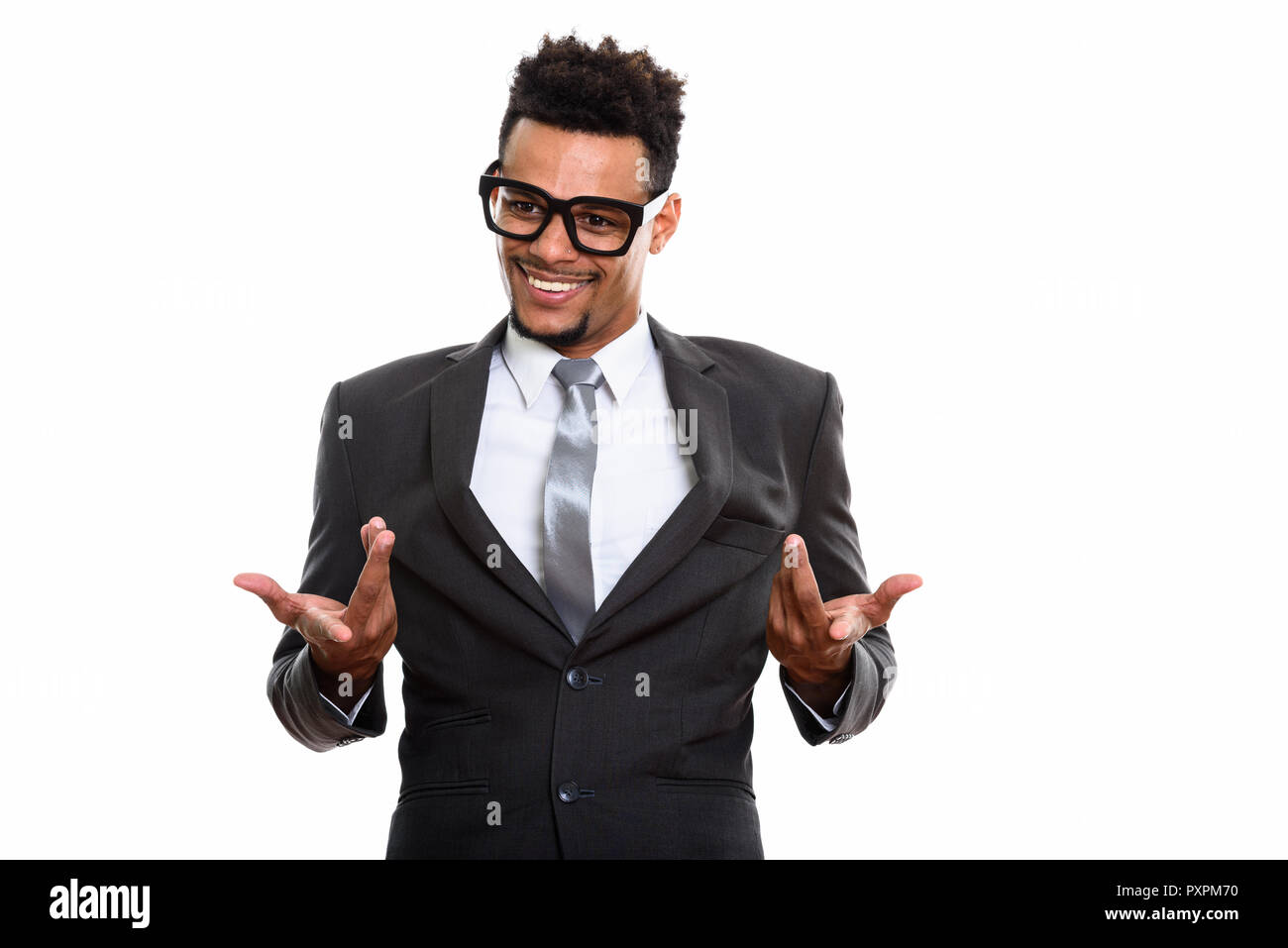 Confused businessman shrugging with raised arms hi-res stock ...