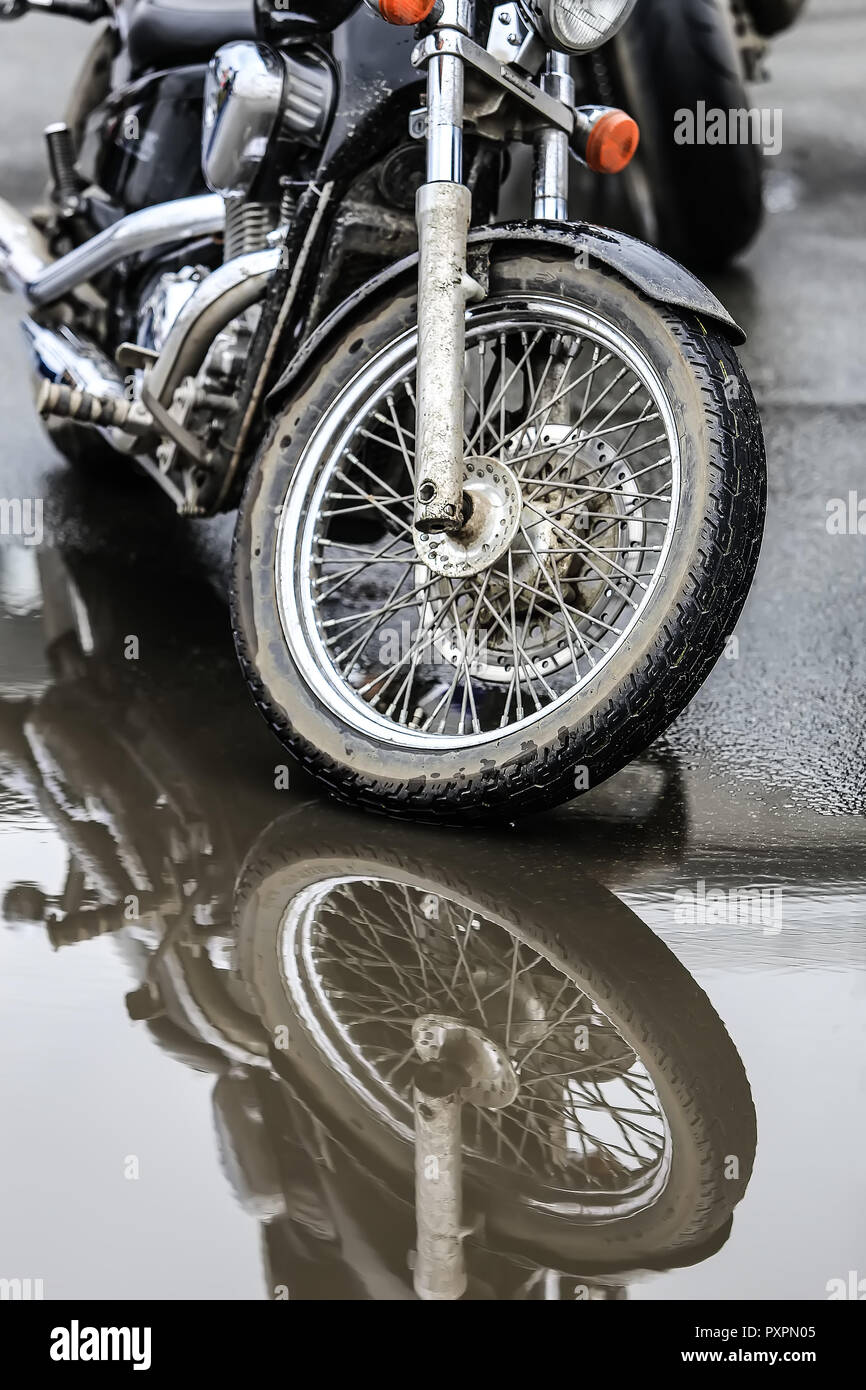 motorcycles on parking on asphalt close up Stock Photo - Alamy