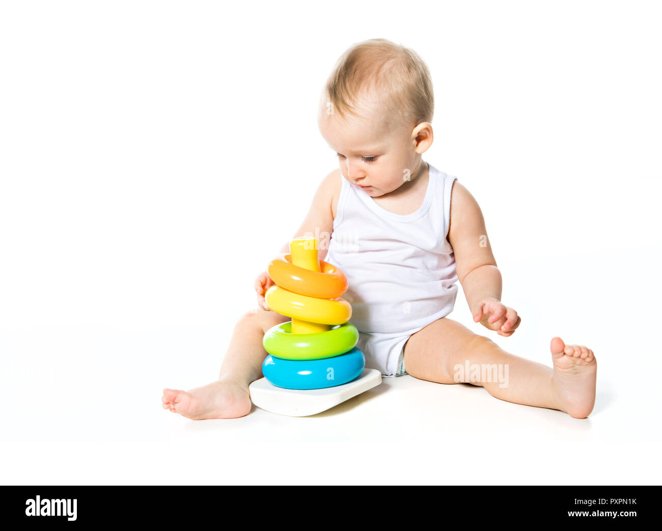 child girl plays the pyramid toy Stock Photo - Alamy