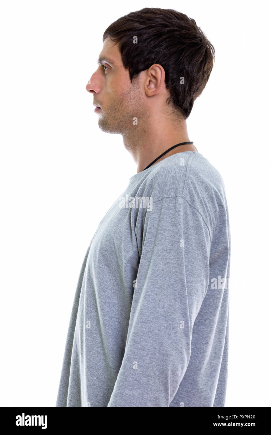 Profile view of young handsome man standing Stock Photo - Alamy