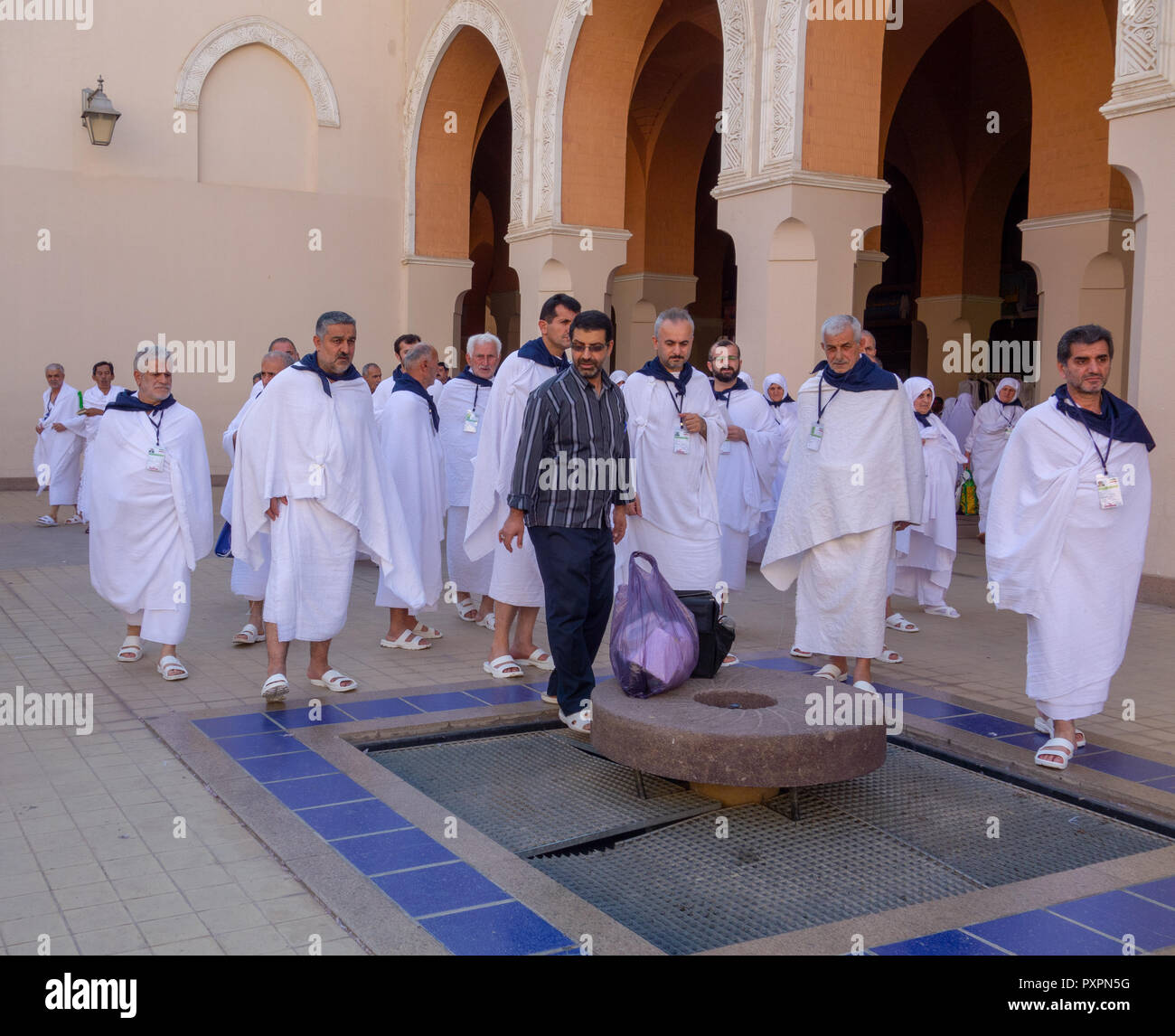 AL MADINAH, SAUDI ARABIA-CIRCA 2014 : A group of unidentified Muslim ...