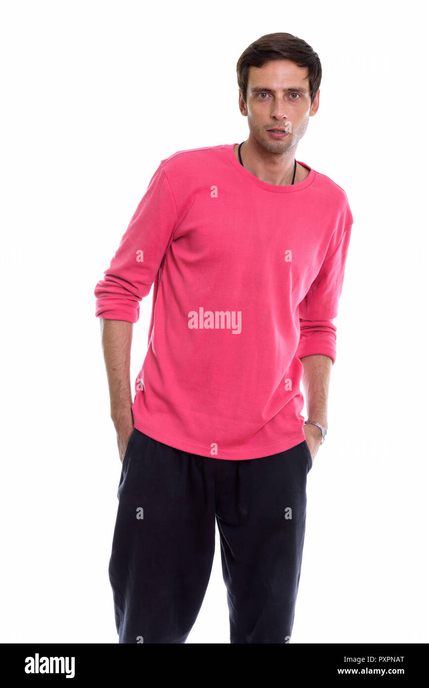 Studio shot of young handsome man standing while posing with han Stock ...