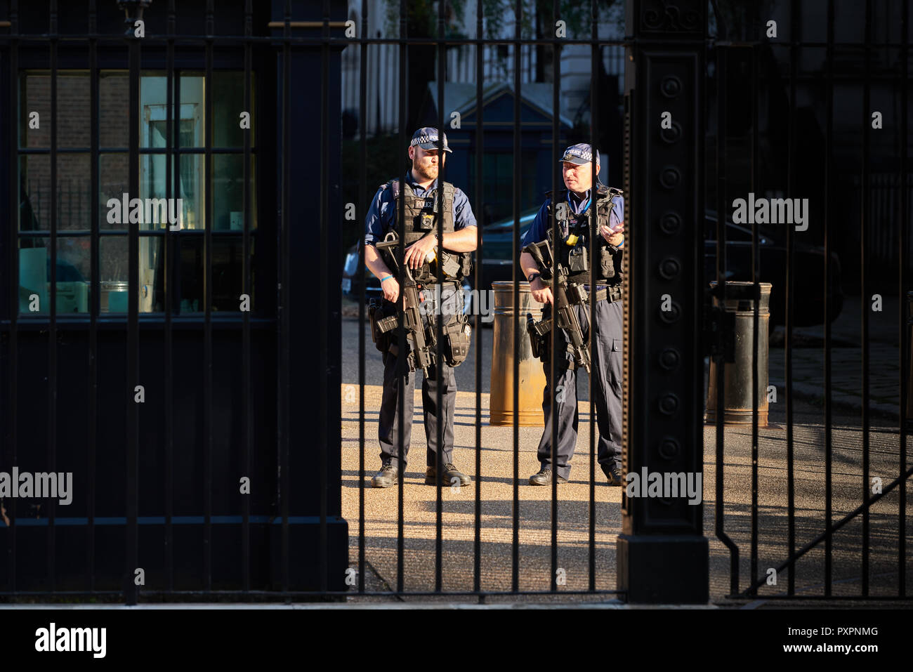 Two armed policeman guard the residence of the british prime minister ...