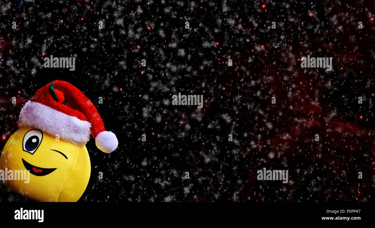 Background with a picture of a cheerful smiley in a red hat to create a ...