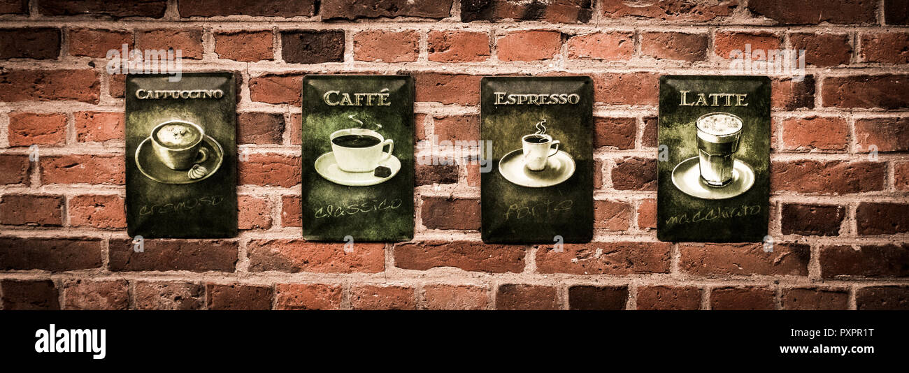 Various coffee signs against a brick wall background Stock Photo - Alamy