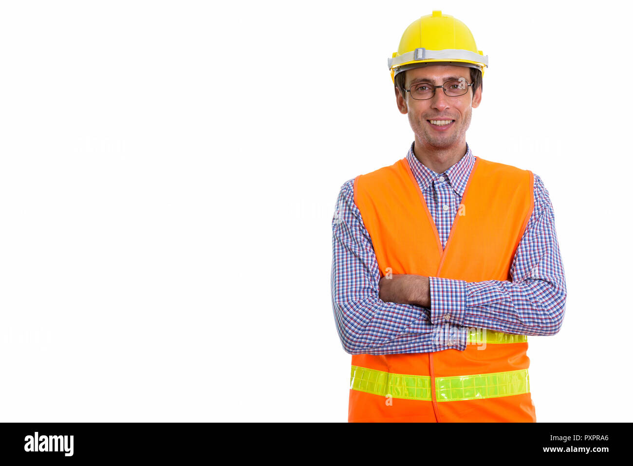 Studio shot of young happy man construction worker smiling while Stock ...